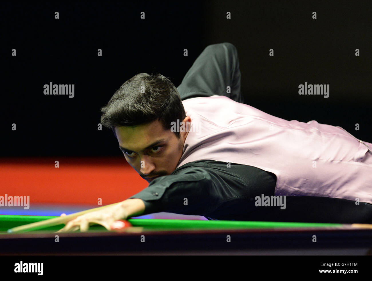 Aditya Mehta at the table in his second round match against Judd Trump ...
