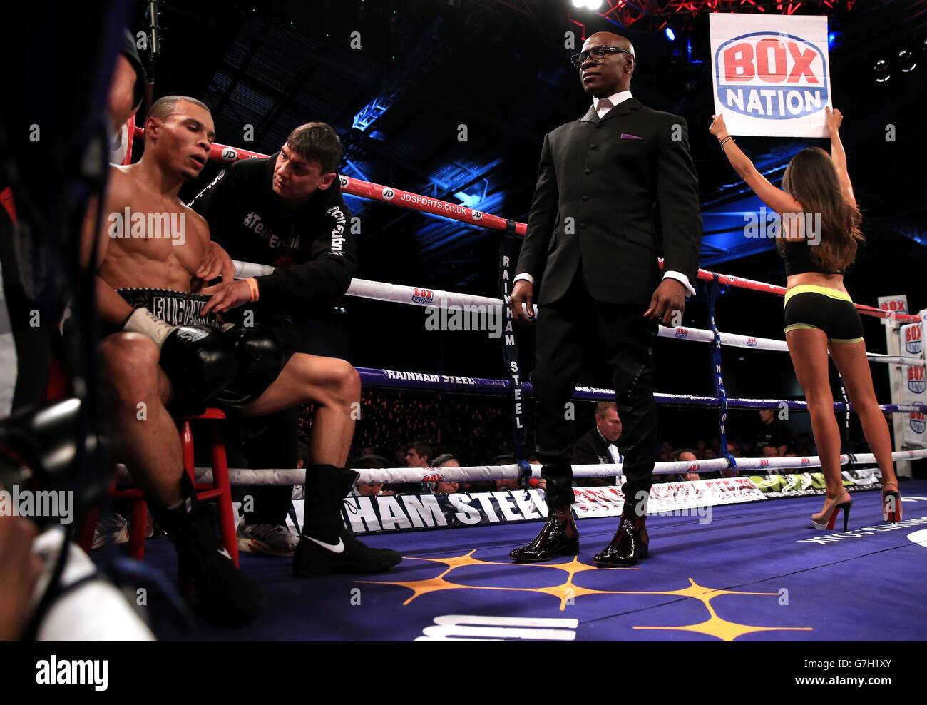 Chris Eubank Junior sits in his corner, over seen by his father Chris ...
