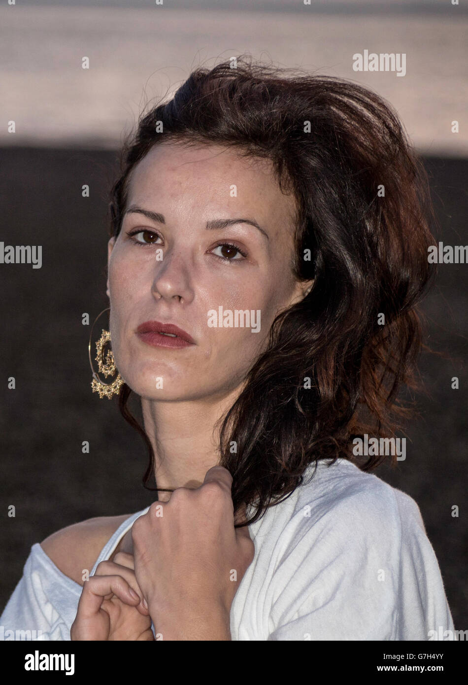 A head and shoulder shot of the Model facing the camera, her left ...