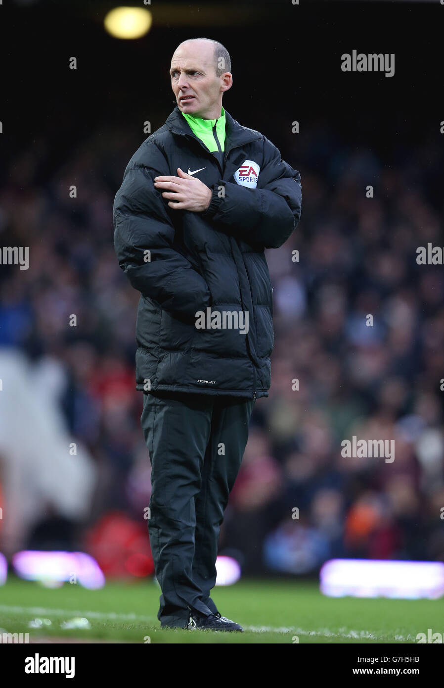 Fourth official Mike Dean during the Barclays Premier League match at ...