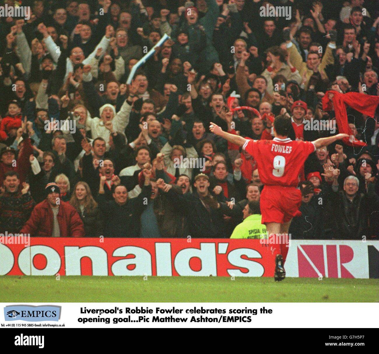 Liverpool's Robbie Fowler celebrates scoring the opening goal Stock ...