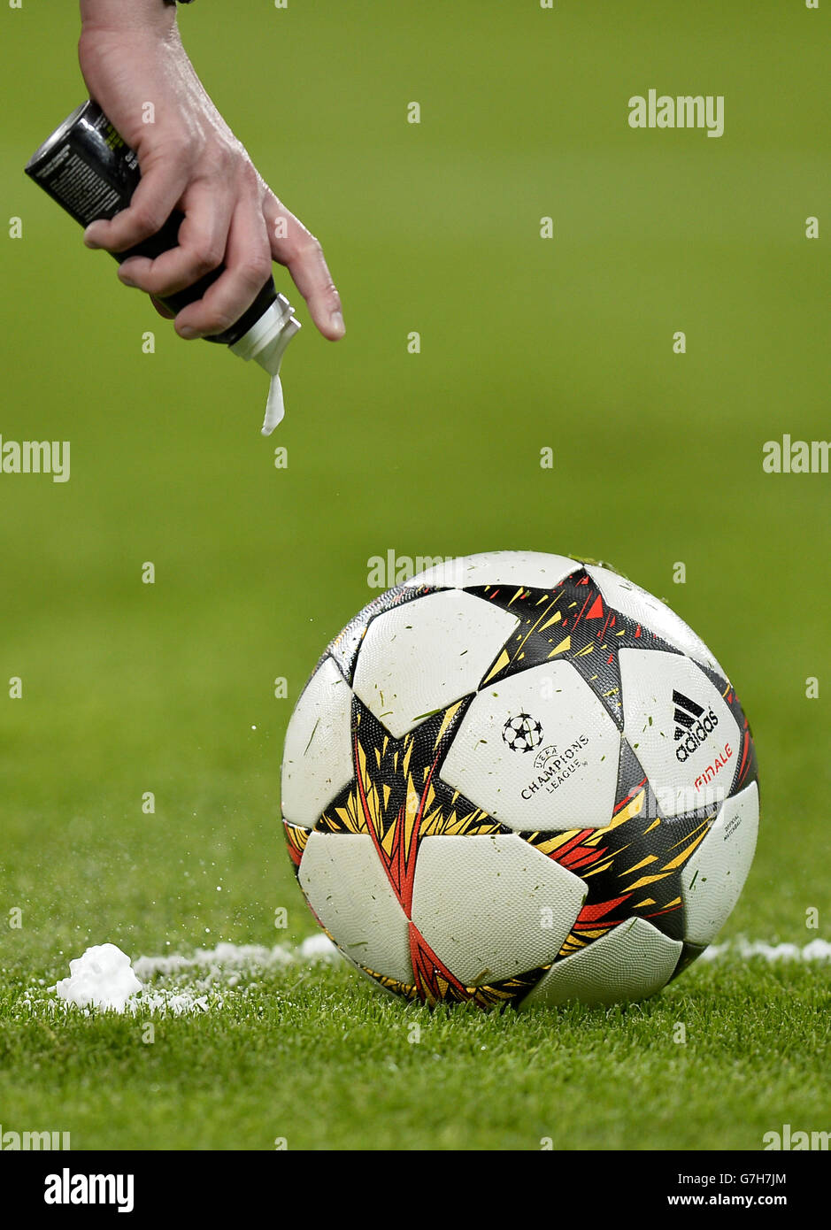 The referee sprays some vanishing spray around an official Adidas ...