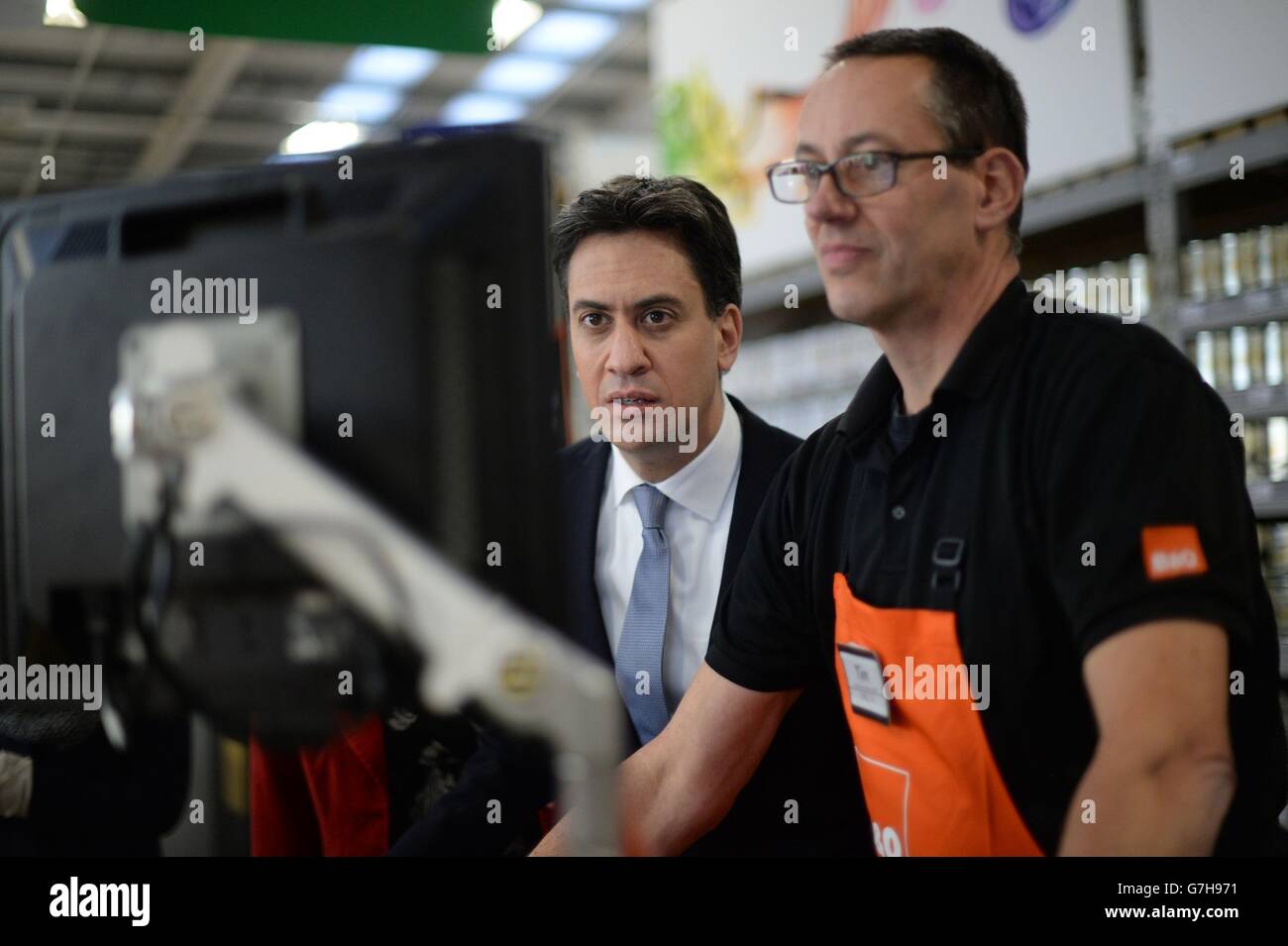 Labour leader Ed Miliband has a demonstration on how to mix paint by ...
