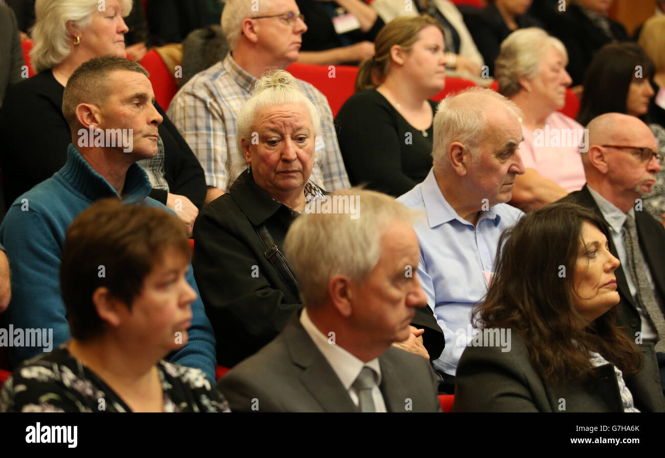 Family members including Anna Squires (centre) react as the report is ...