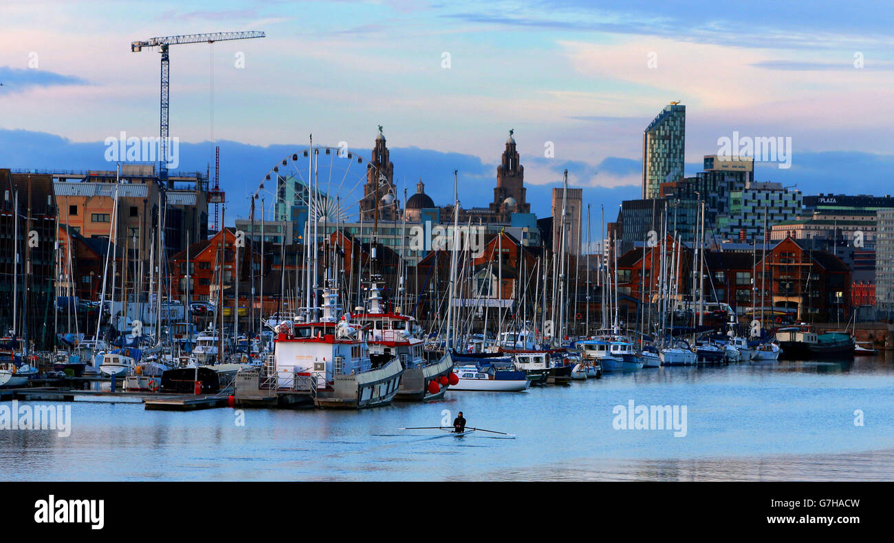 A canoeist rows along the water at Brunswick Dock, Liverpool, as the ...