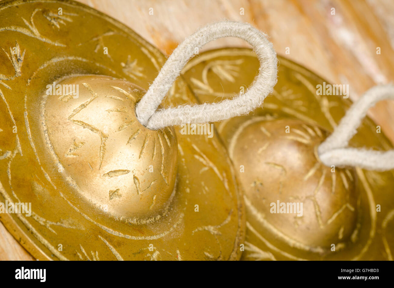 Finger cymbals on a rustic background Stock Photo - Alamy