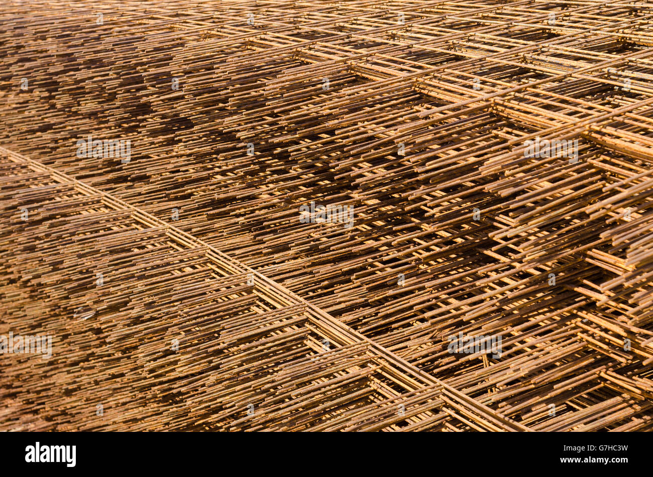 Steel mesh hole in close-up. Screw thread steel bar framework in the ...