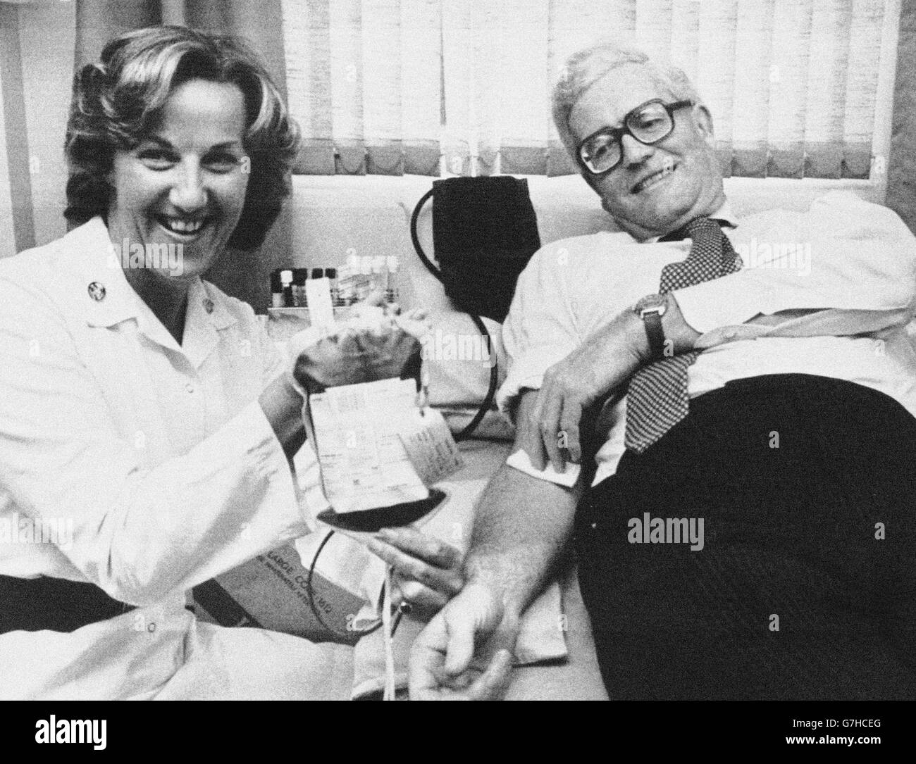 Ann Jordan helps Northern Ireland Secretary of State Douglas Hurd give ...