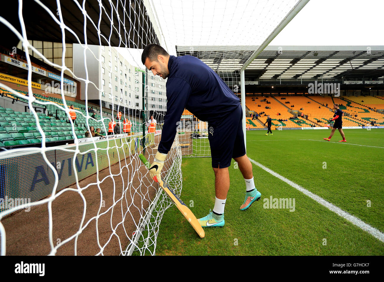 Reading goalkeeper Adam Federici places a cricket bat behind his goal ...