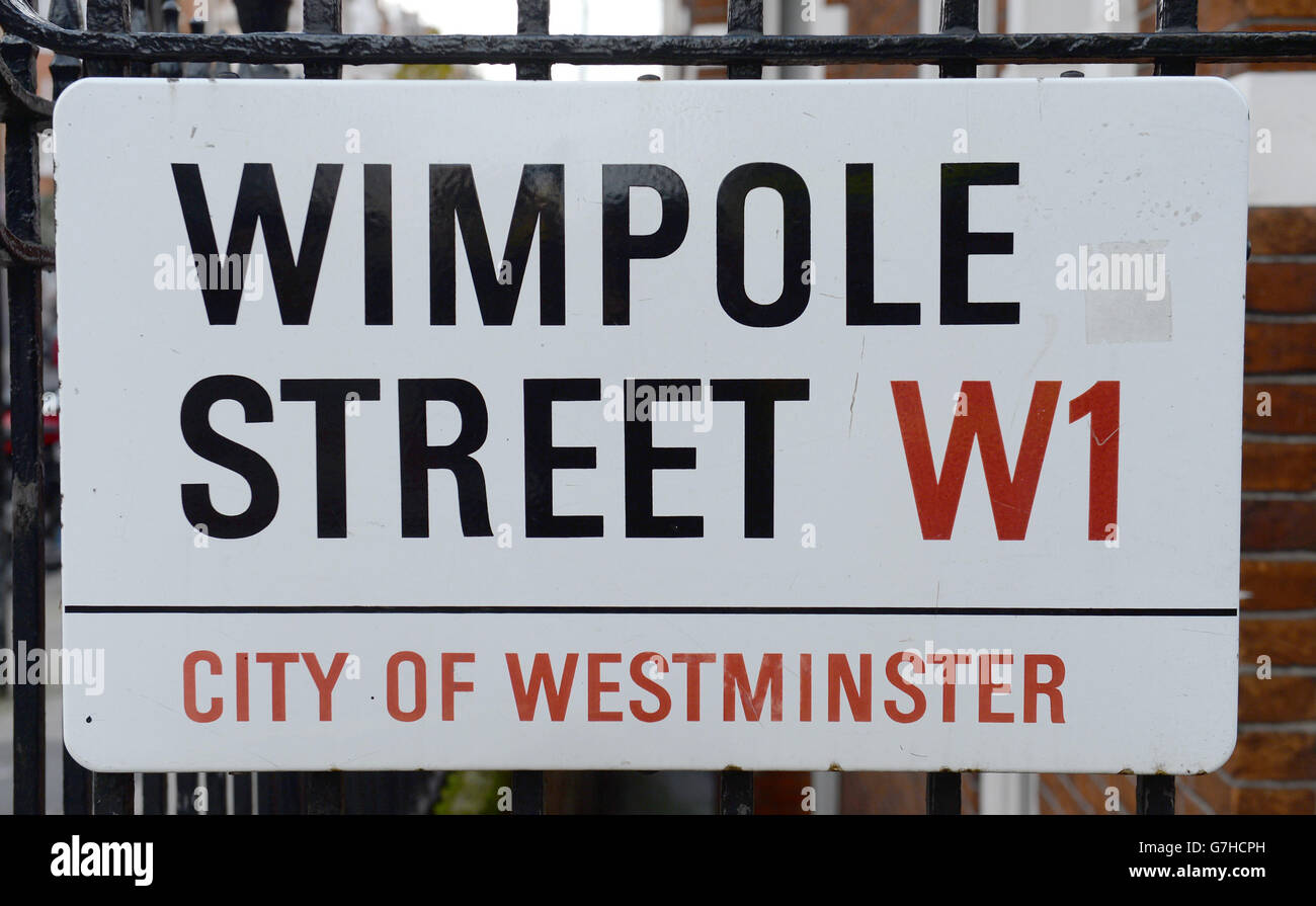 The street sign as firefighters attend the scene of a house fire in ...