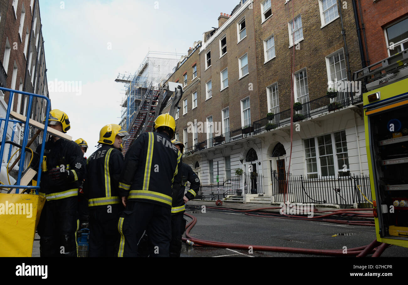 Firefighters attend the scene of a house fire in Wimpole Street ...