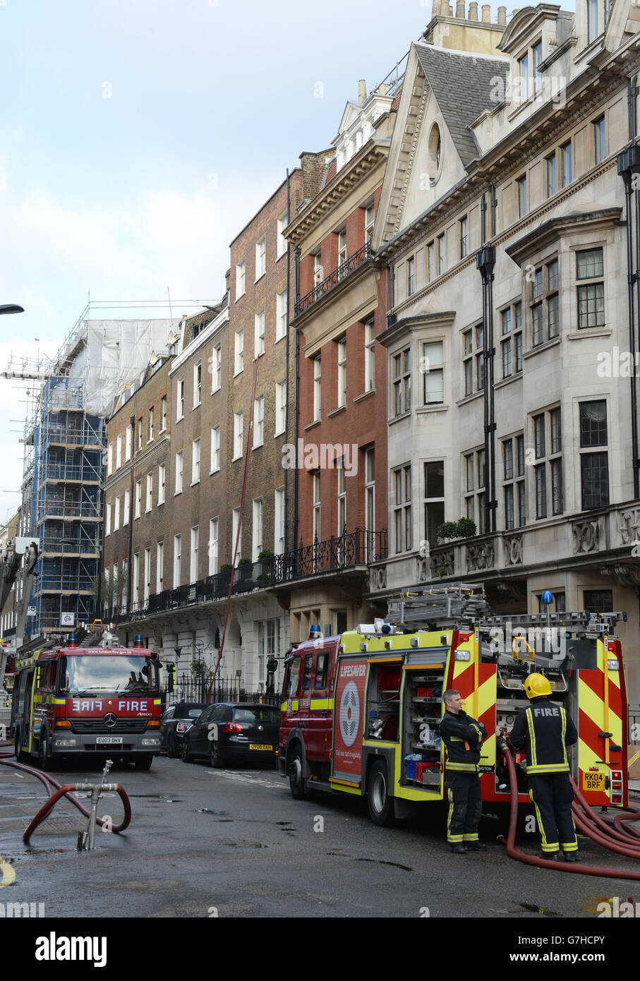 Firefighters attend the scene of a house fire in Wimpole Street ...