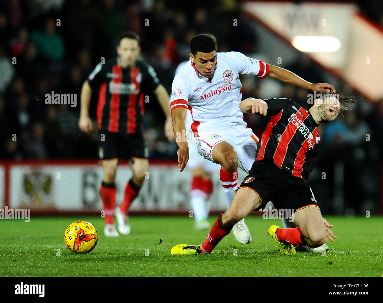 Cardiff City's Tom Adeyemi (centre) fouls Bournemouth's Harry Arter ...