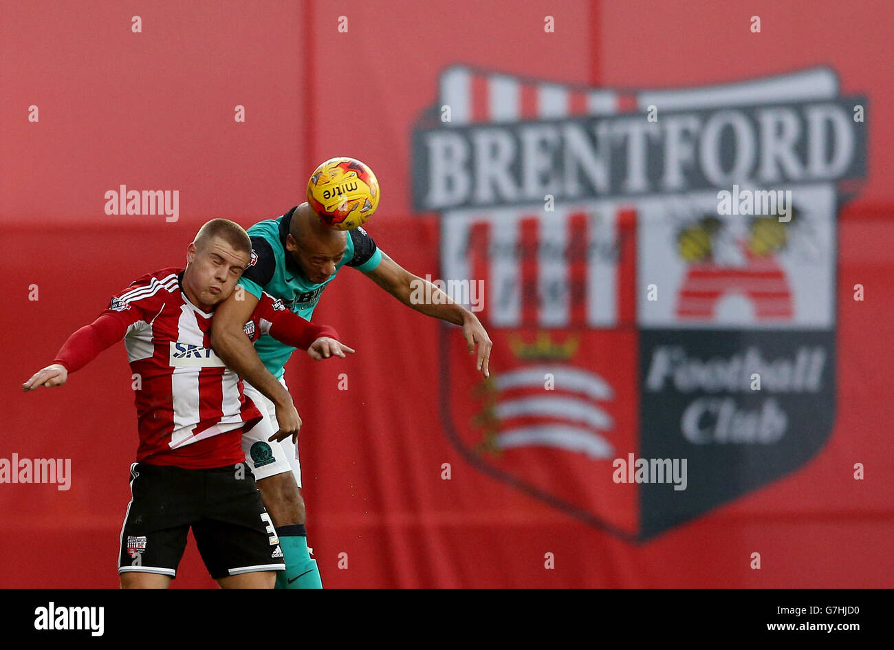 Brentford's Jake Bidwell and Blackburn Rovers' Alex Baptiste challenge ...
