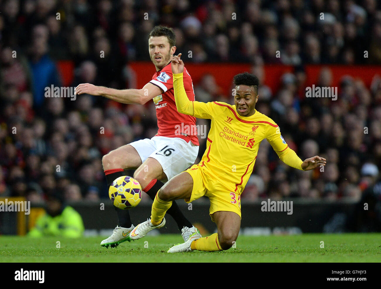Manchester United's Michael Carrick (left) and Liverpool's Raheem ...
