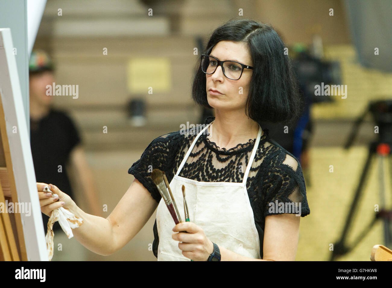 Artist painting portrait at Easel Stock Photo - Alamy