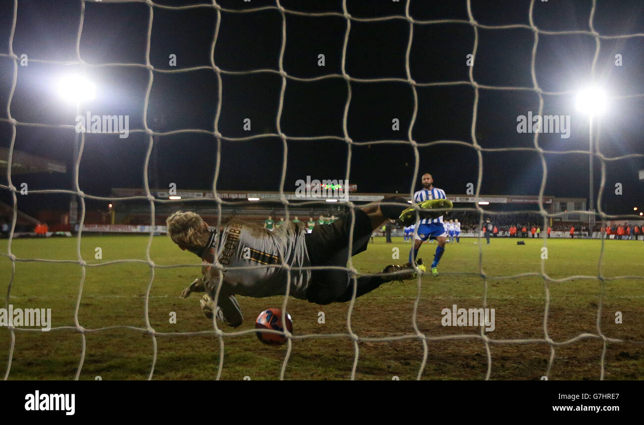 Scunthorpe United's Sam Slocombe saves the penalty from Worcester City ...