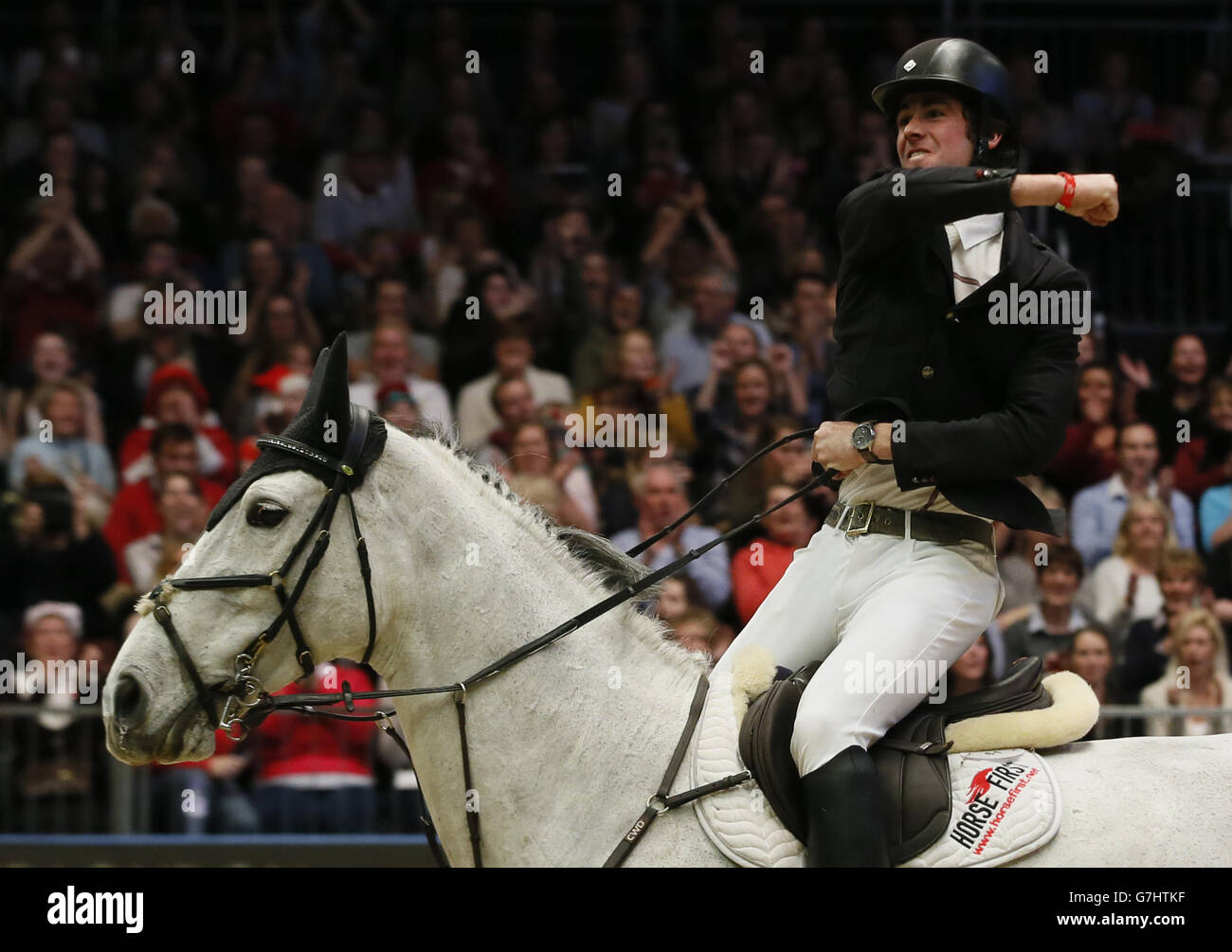 Ireland's David Simpson riding his horse Richi Rich, goes clear to win the Christmas Puissance ...