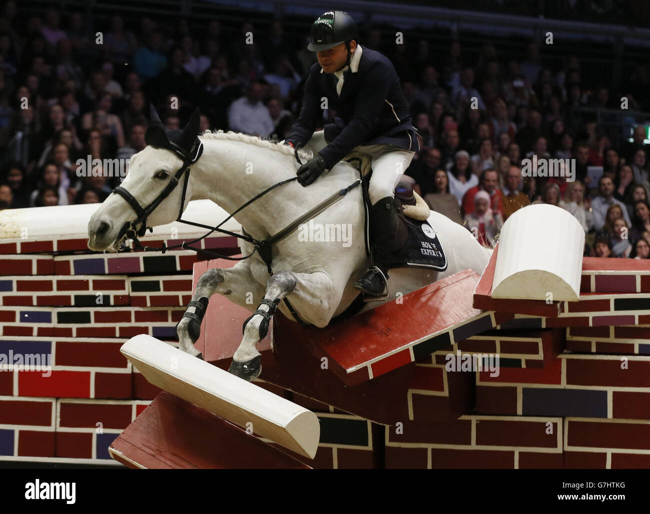 Ireland's David Simpson riding his horse Richi Rich, goes clear to win ...