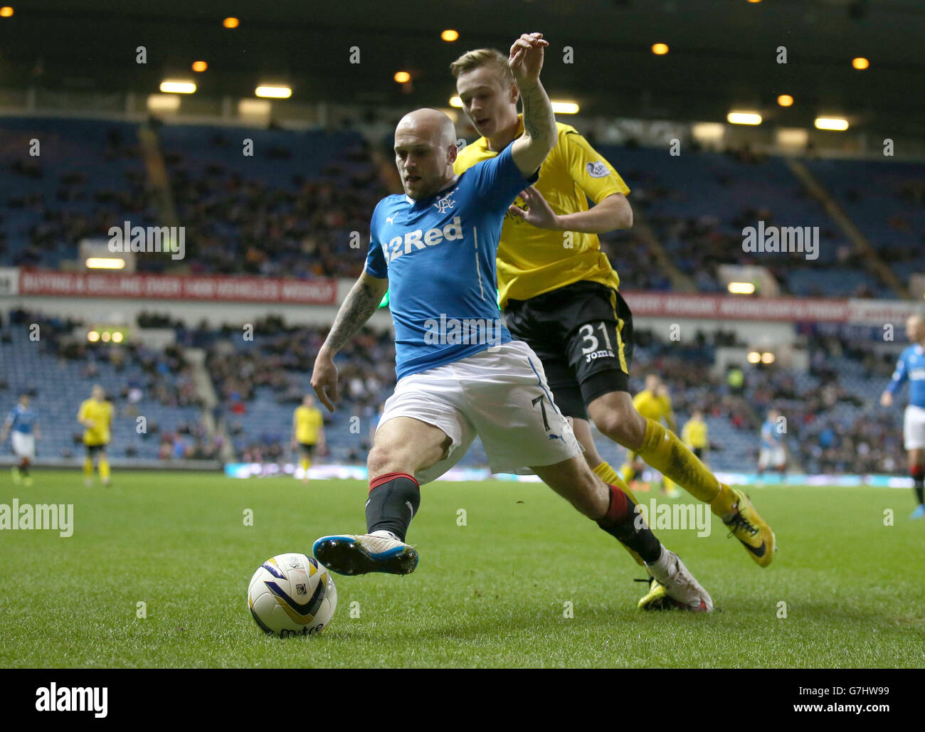 Rangers Nicky Law challenges Livingston's Shaun Rutherford during the ...