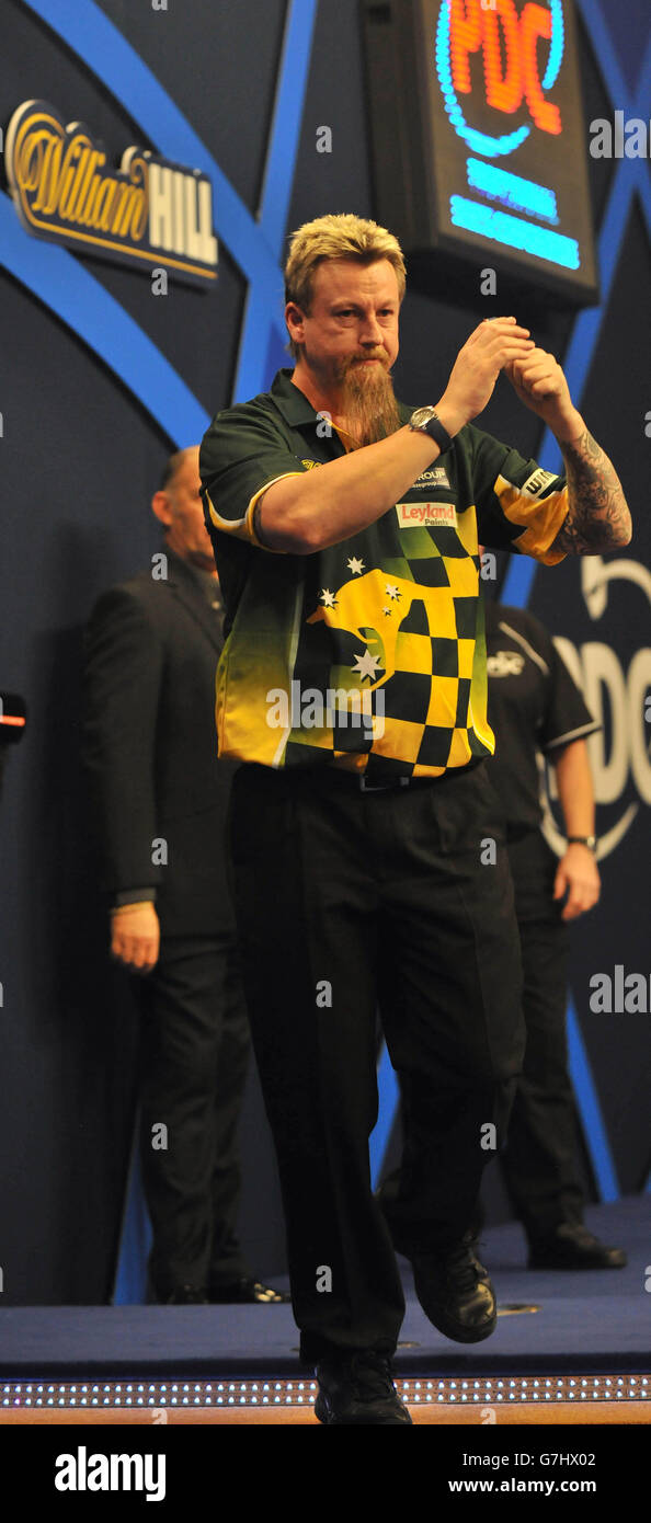Simon Whitlock leaves the stage after his first round match against ...