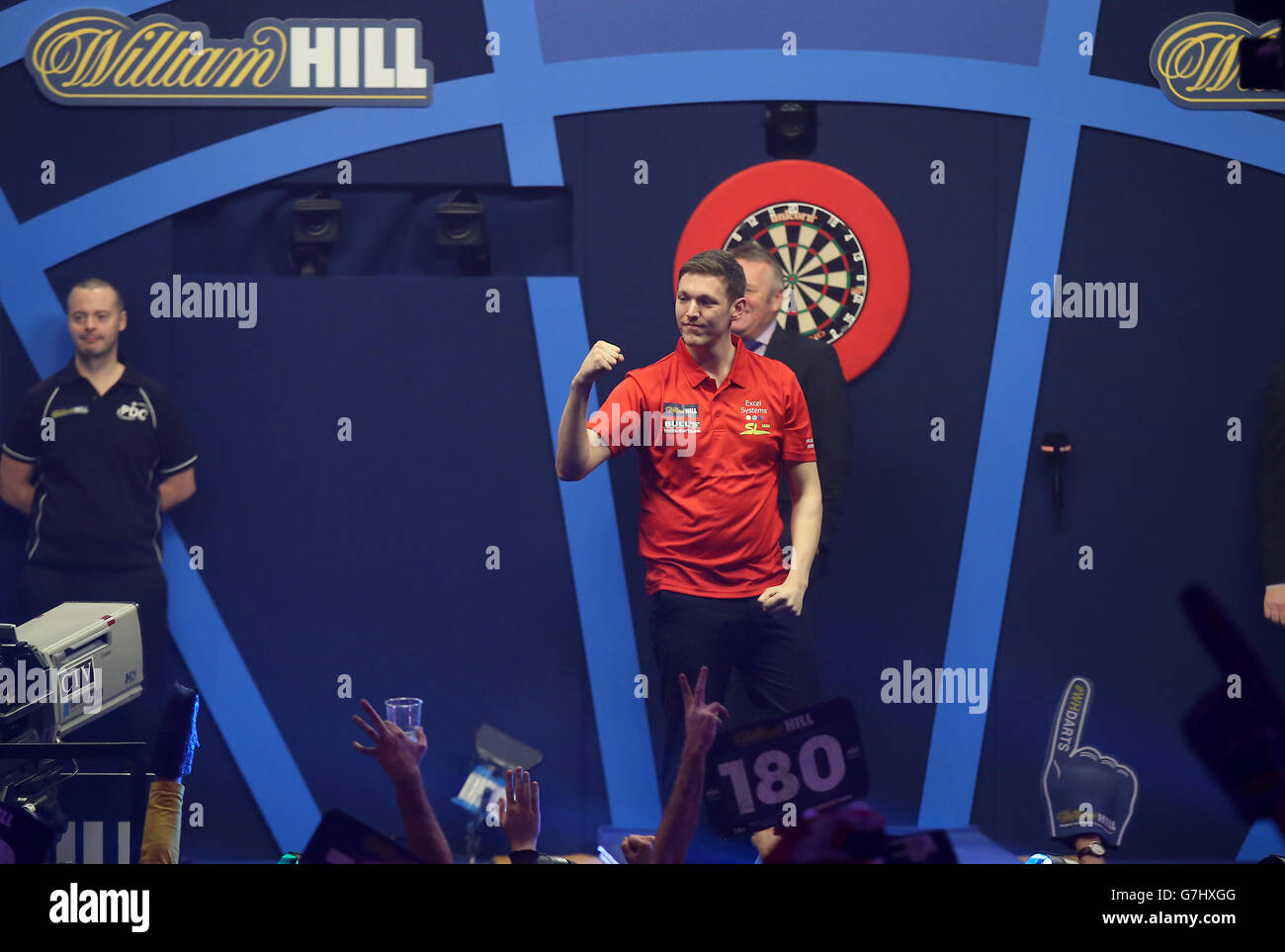 David Pallett waves to the crowd as he walks on for his match against ...