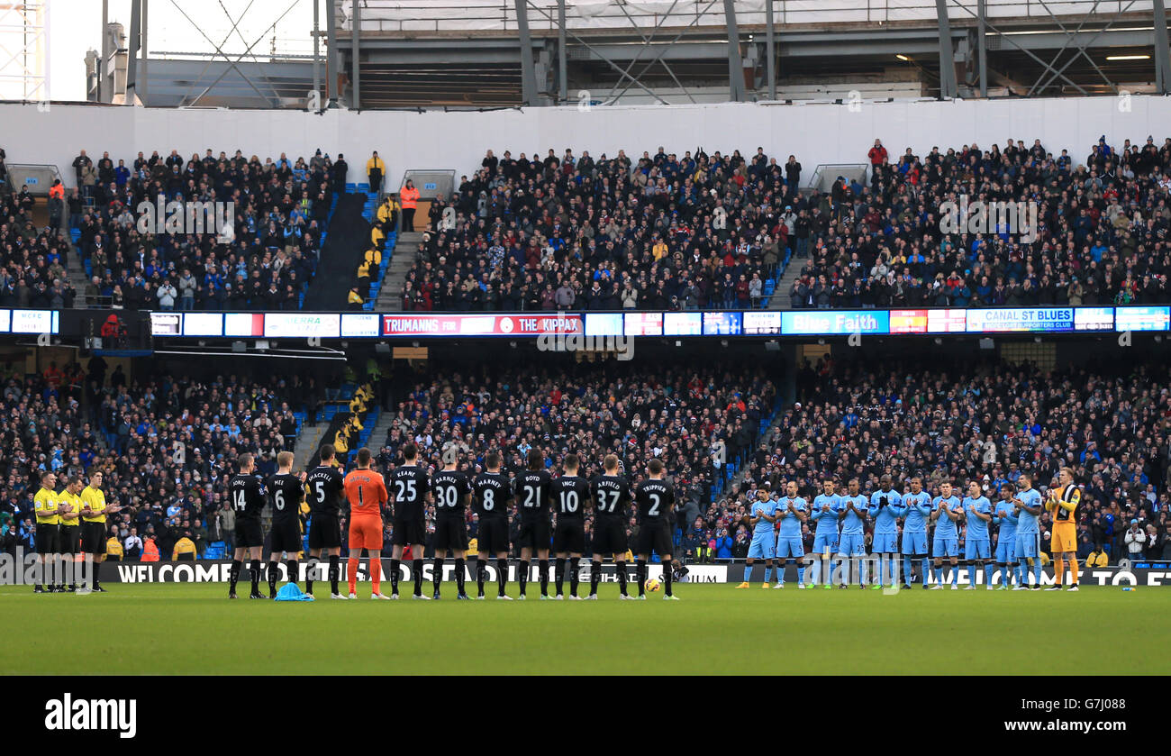 Manchester City and Burnley players observe a minute's applause to ...
