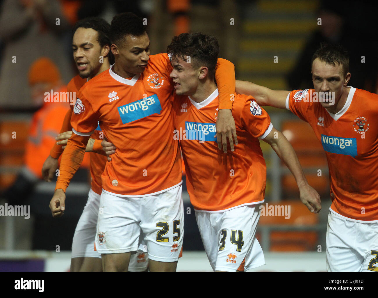 Blackpool's Dom Telford celebrates scoring with team mates Jacob Murphy ...