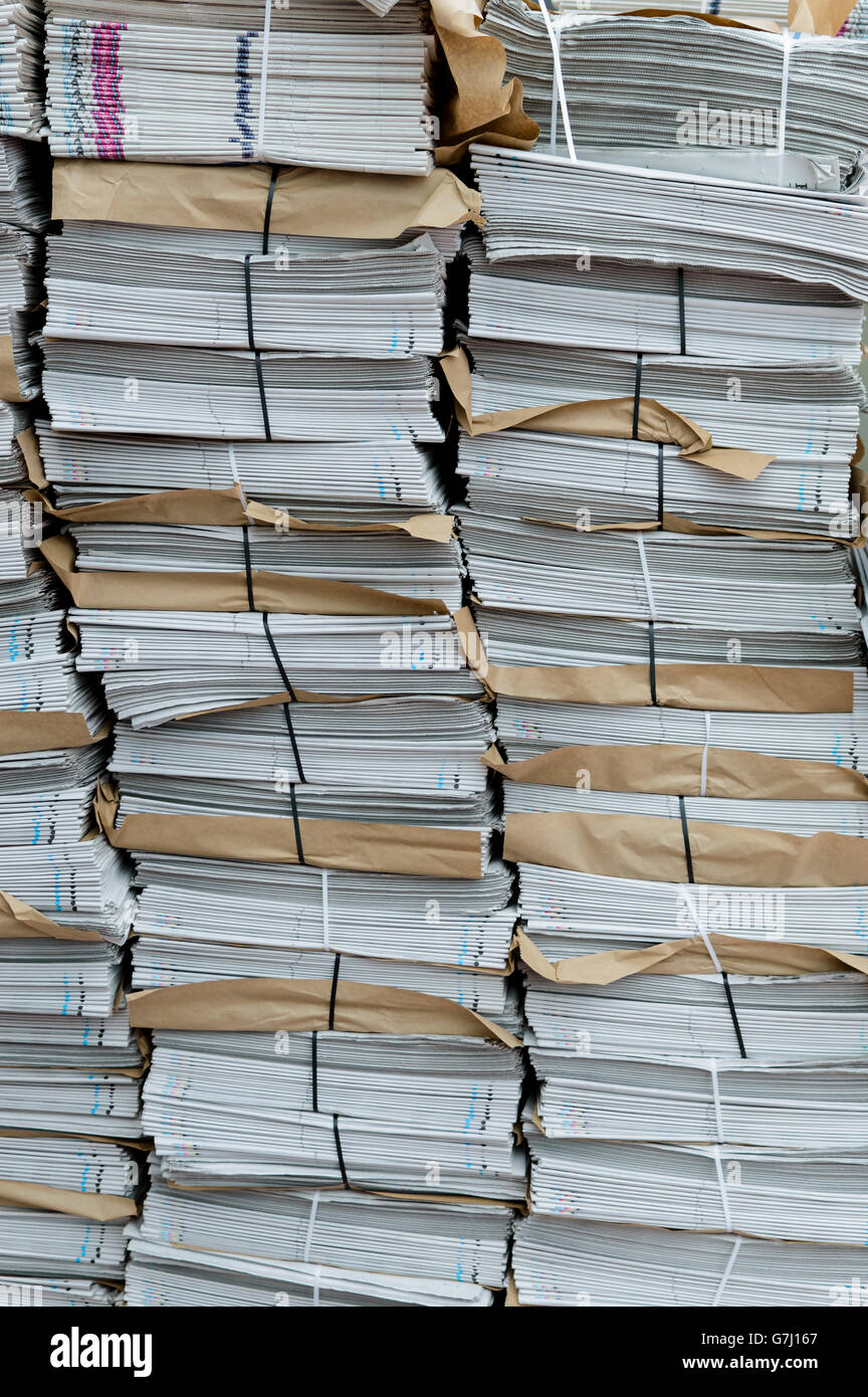 Stack of newspapers stored vertically Stock Photo - Alamy