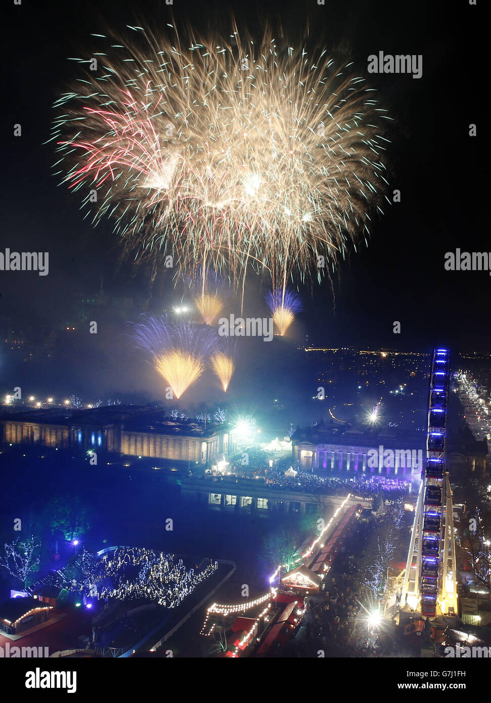 Fireworks mark the beginning of 2015 during the Hogmanay New Year ...