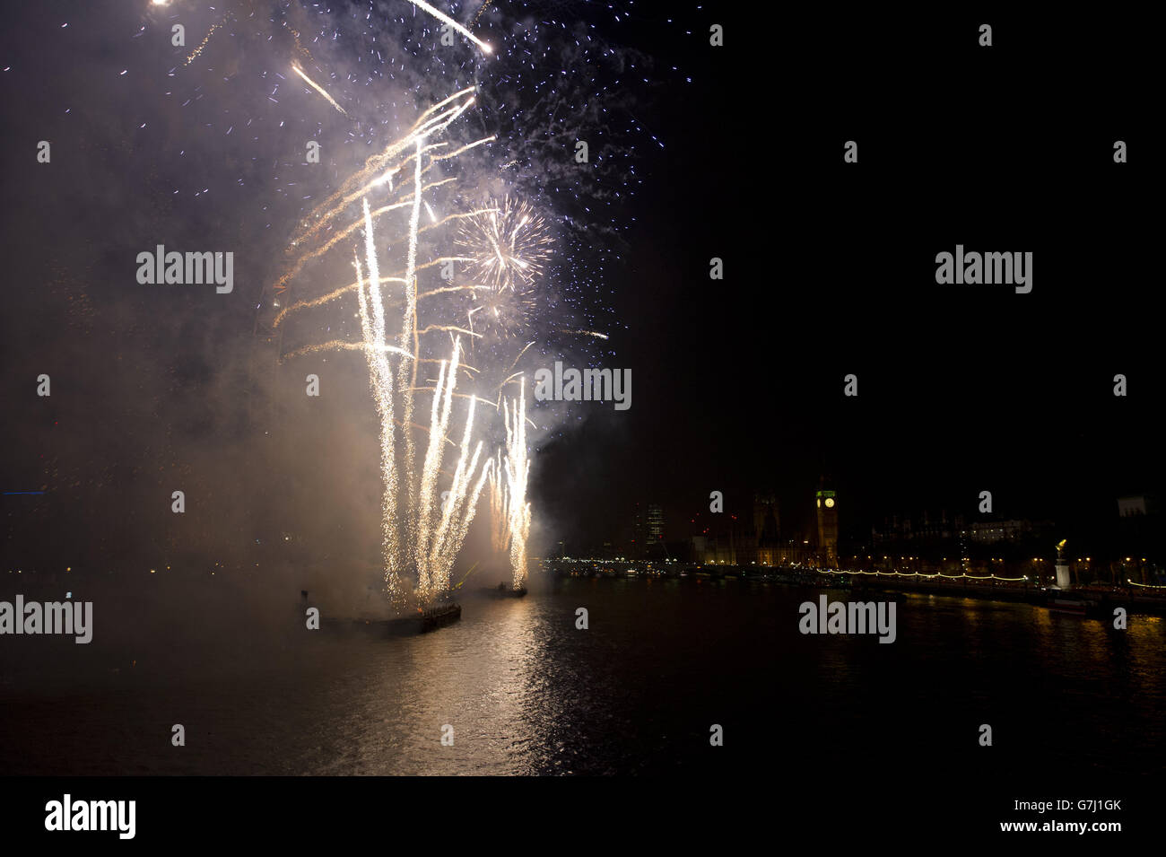 Fireworks light up the sky over the London Eye in central London during ...