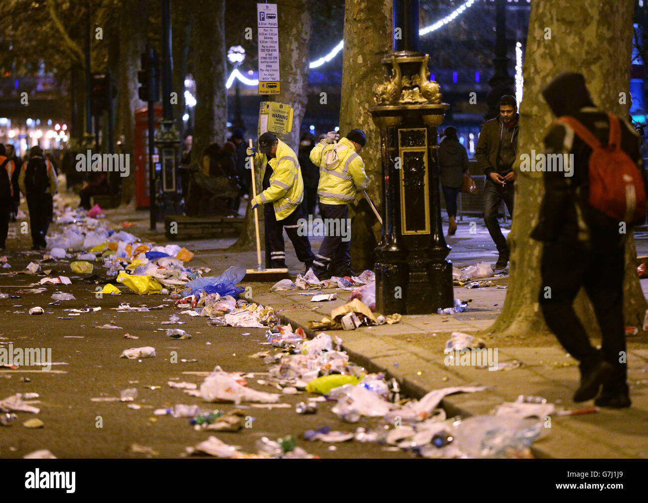 Workers begins to clear away mess left by members of the public on the ...
