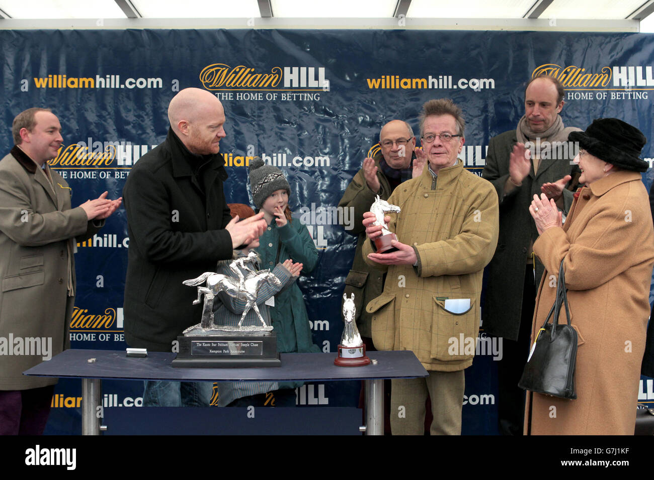 Eastenders actor Jake Wood presents the trophy to trainer of Coneygree ...