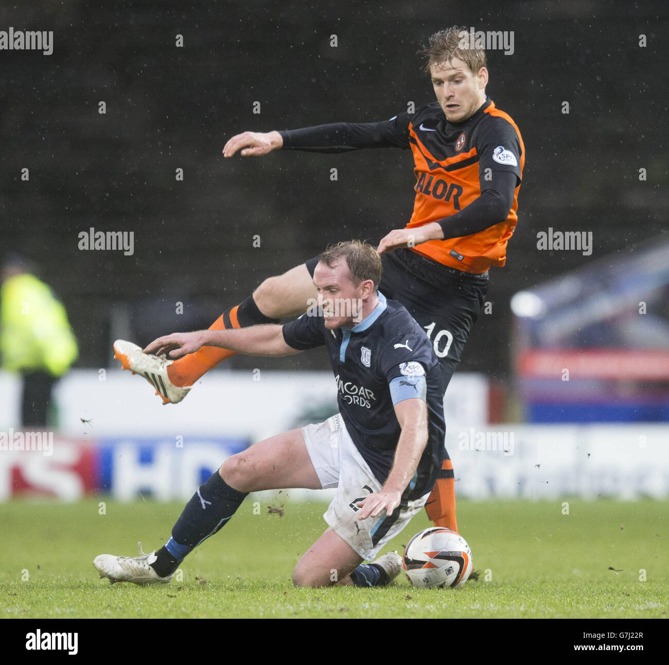 Dundee United's Stuart Armstrong (top) and Dundee's David Clarkson in ...