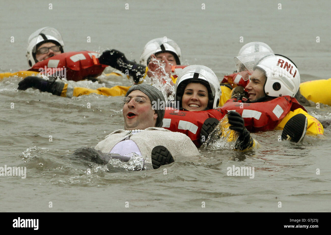 Swimmers take part in the Loony Dook New Year's Day dip in the Firth of ...