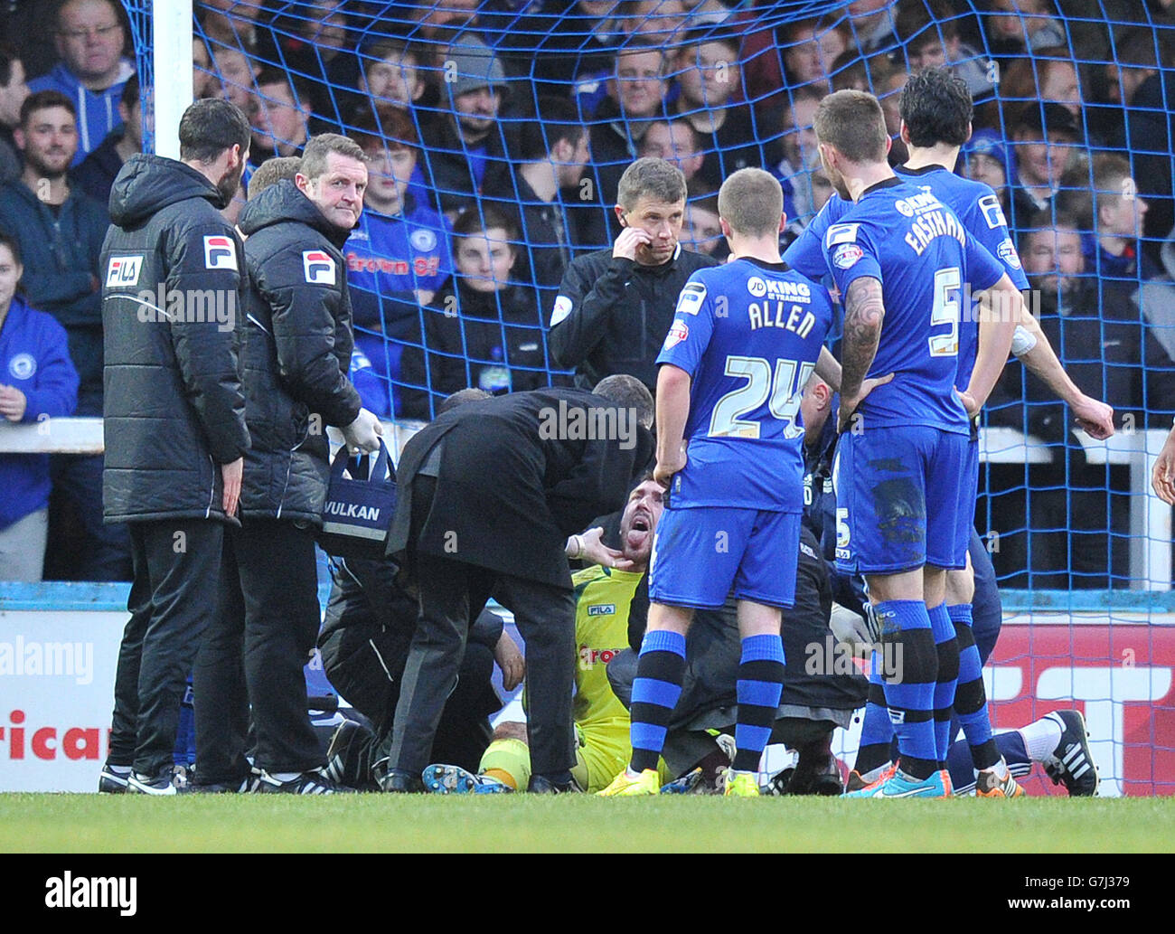 Rochdale's Josh Lillis is given attention after being injured during ...