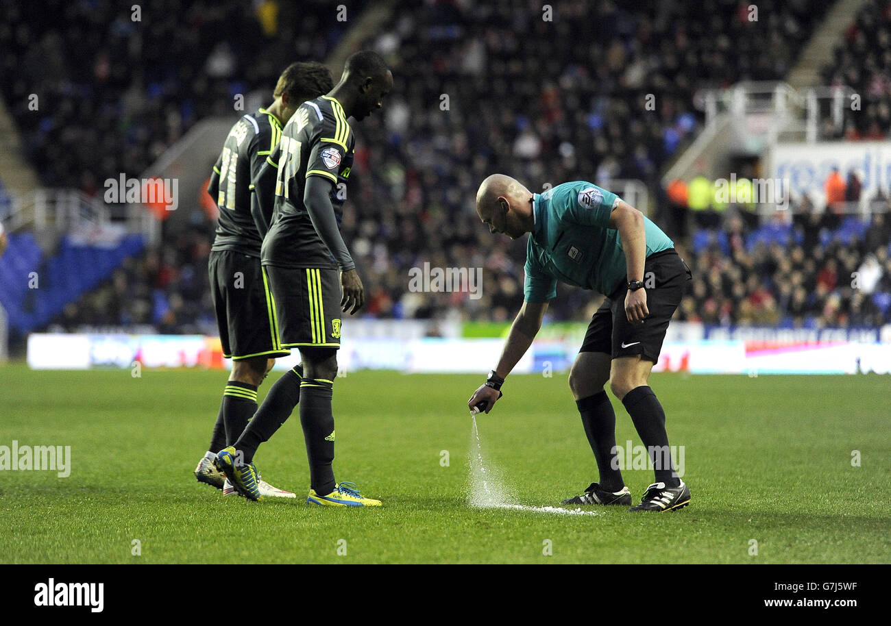 Referee Charles Breakspear uses vanishing spray to mark out the ...