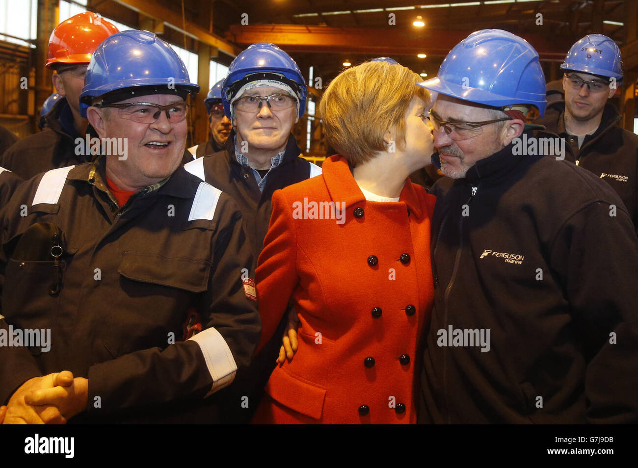 First Minister Nicola Sturgeon gives Hugh Hampsey a kiss as she marks ...