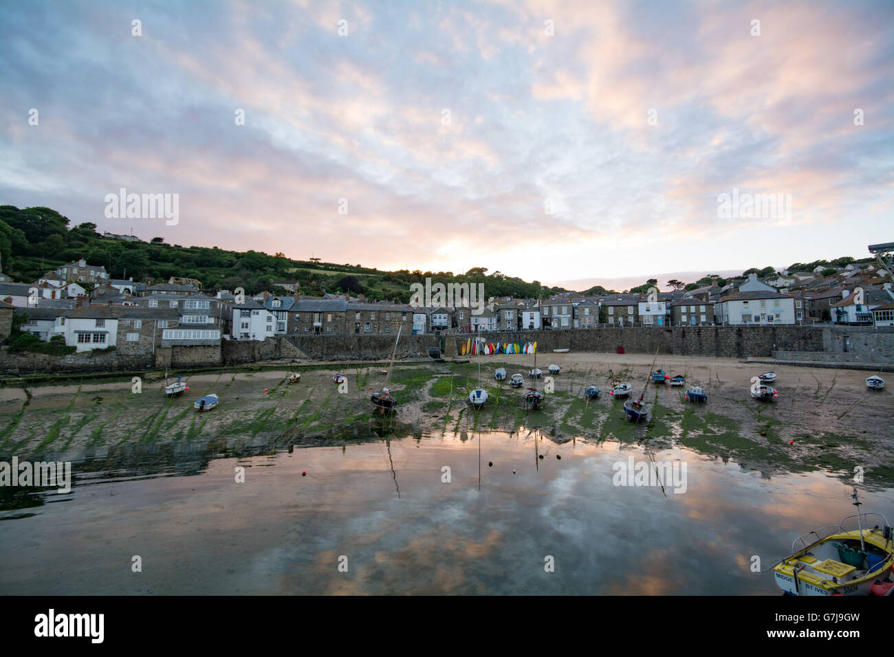 Sunset over Mousehole harbour Stock Photo - Alamy