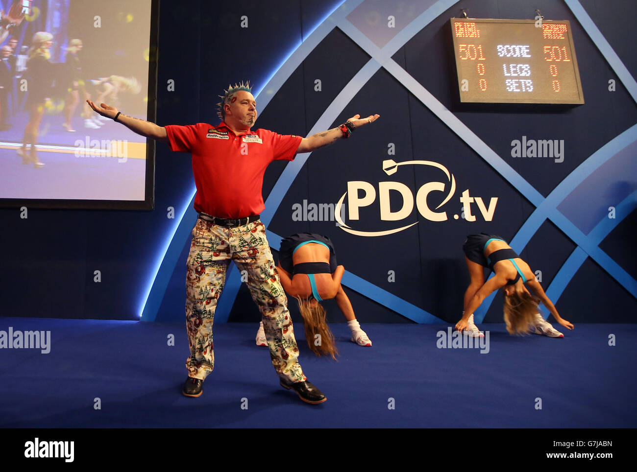 Peter Wright dances for the crowd as he comes onto stage for his match ...