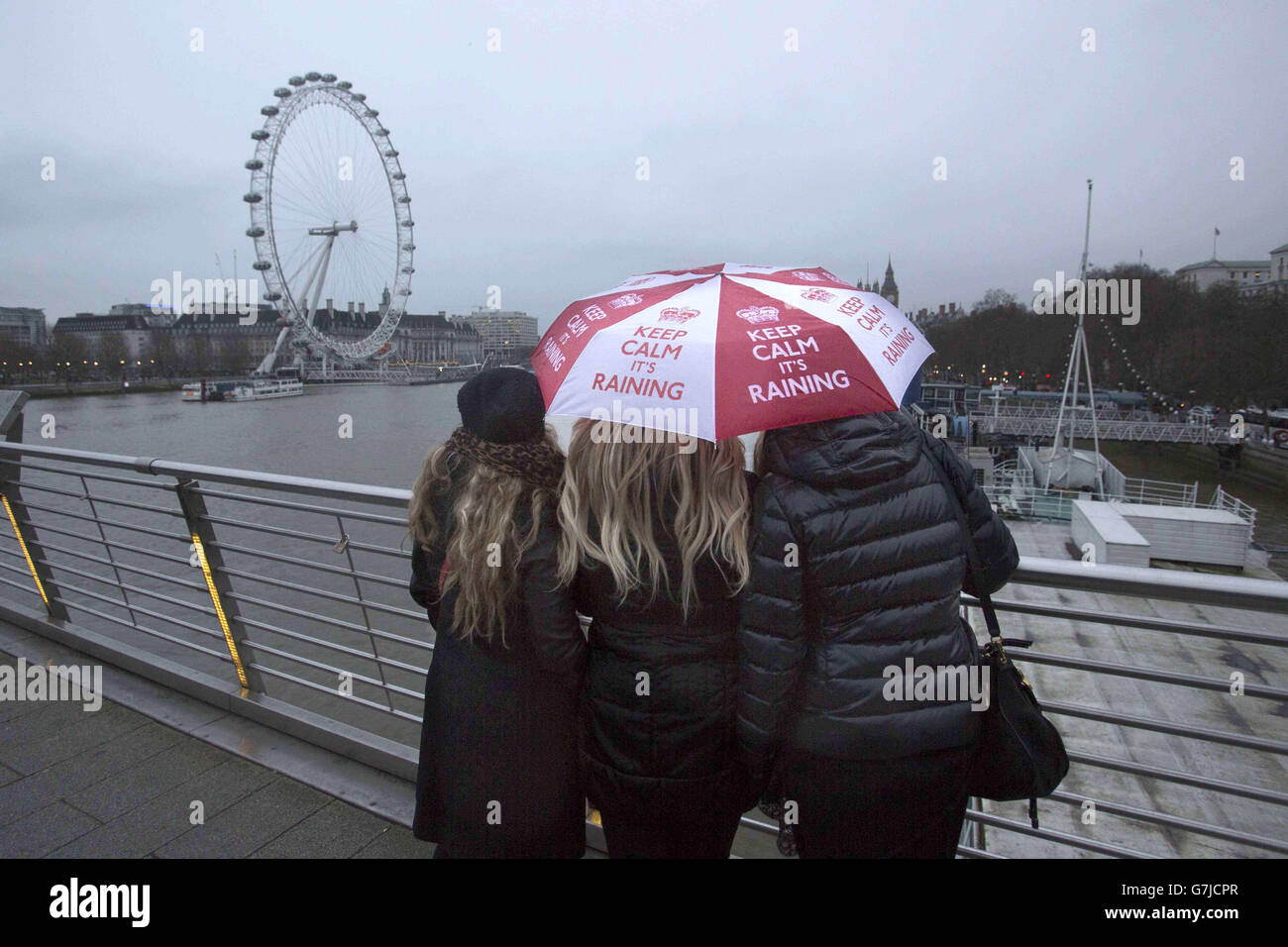 Cold and wet weather along the Embankment in central London, as a large ...