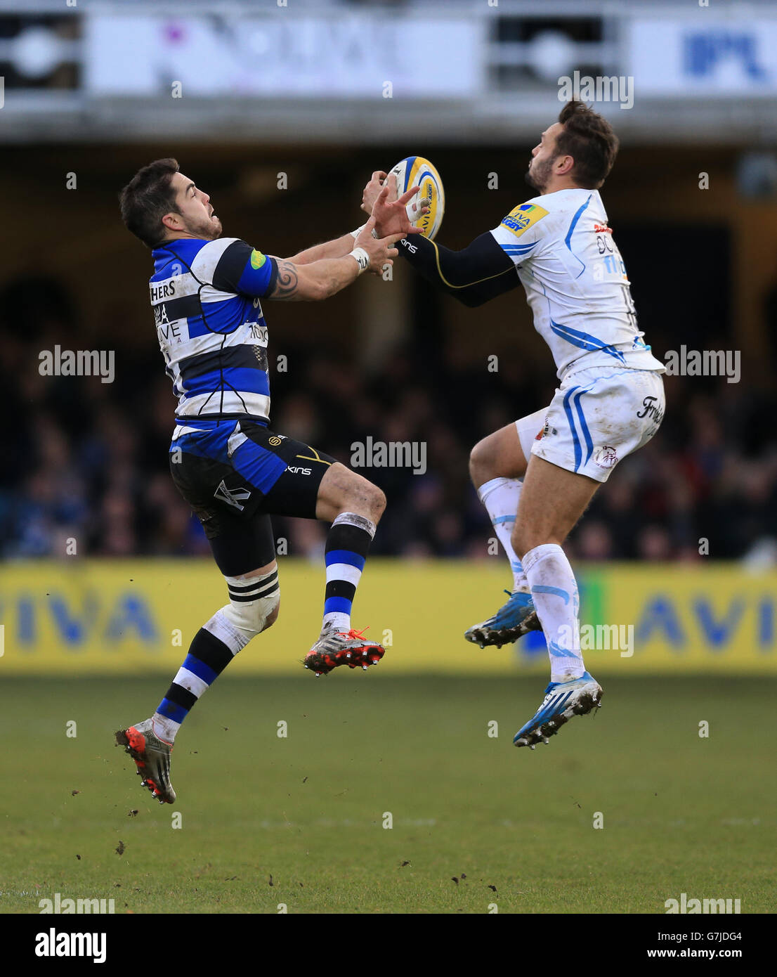 Bath Rugby's Horacio Agulla (left) and Exeter Chiefs Phil Dollman go up ...