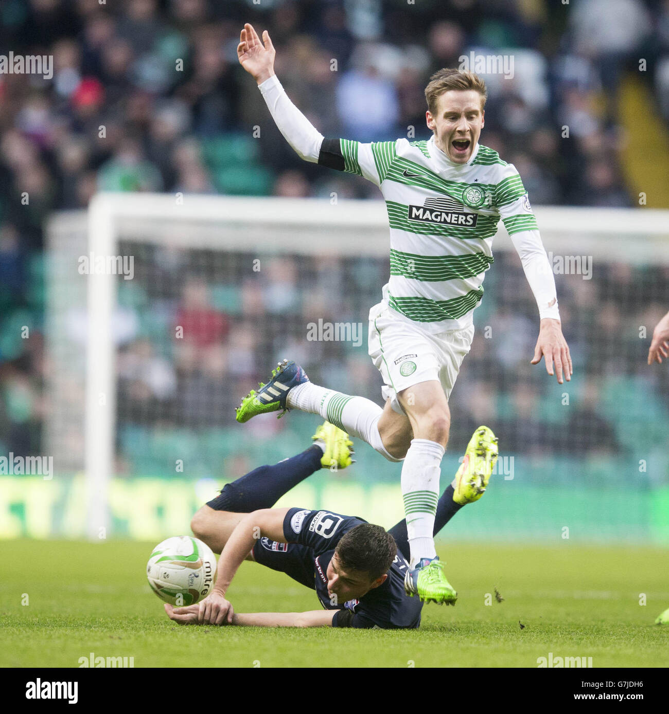 Celtic's Stefan Johansen avoids Ross County's Filip Kiss during the ...