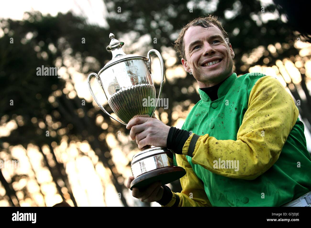 Jockey Denis O'Regan celebrates in the parade ring after winning the ...