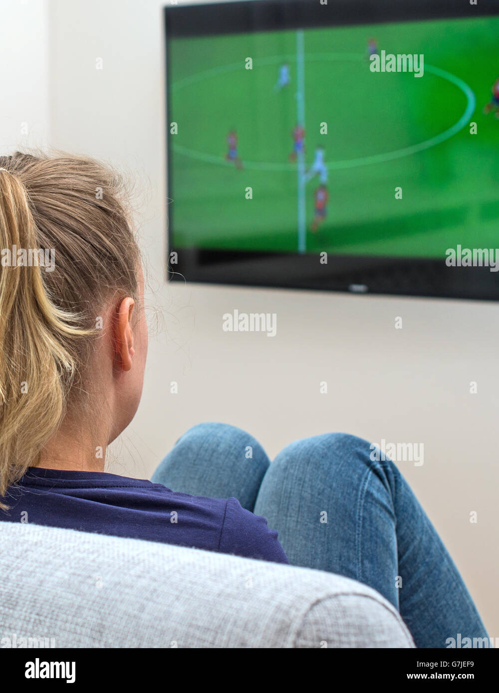 Woman watching tv alone hi-res stock photography and images - Alamy