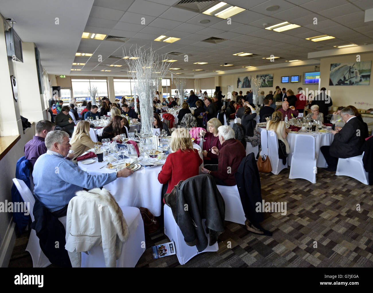 Racegoers enjoy the atmosphere in the desert orchid suite hi-res stock ...