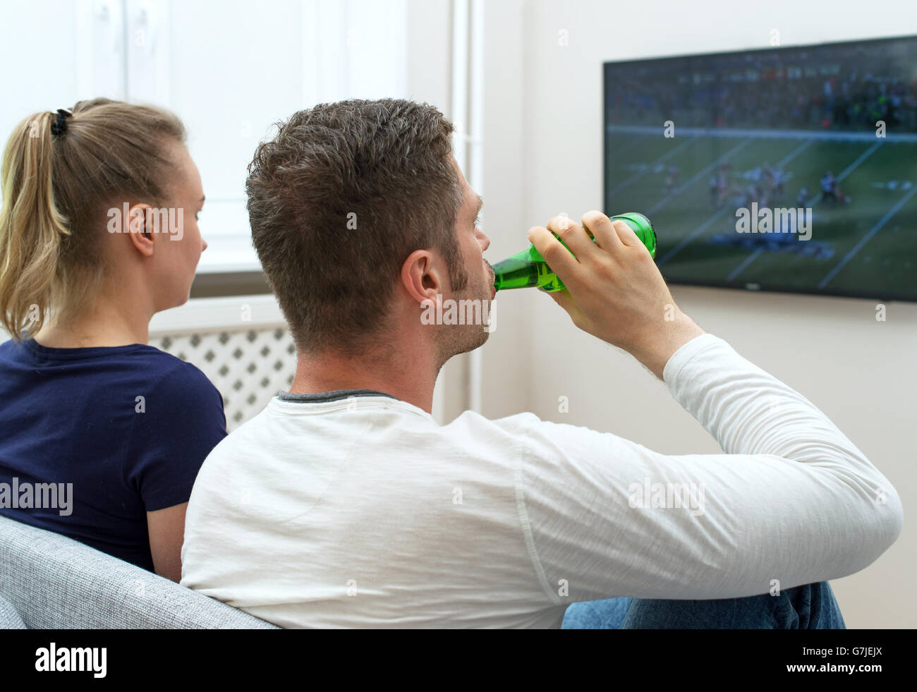 Female watching football hi-res stock photography and images - Alamy
