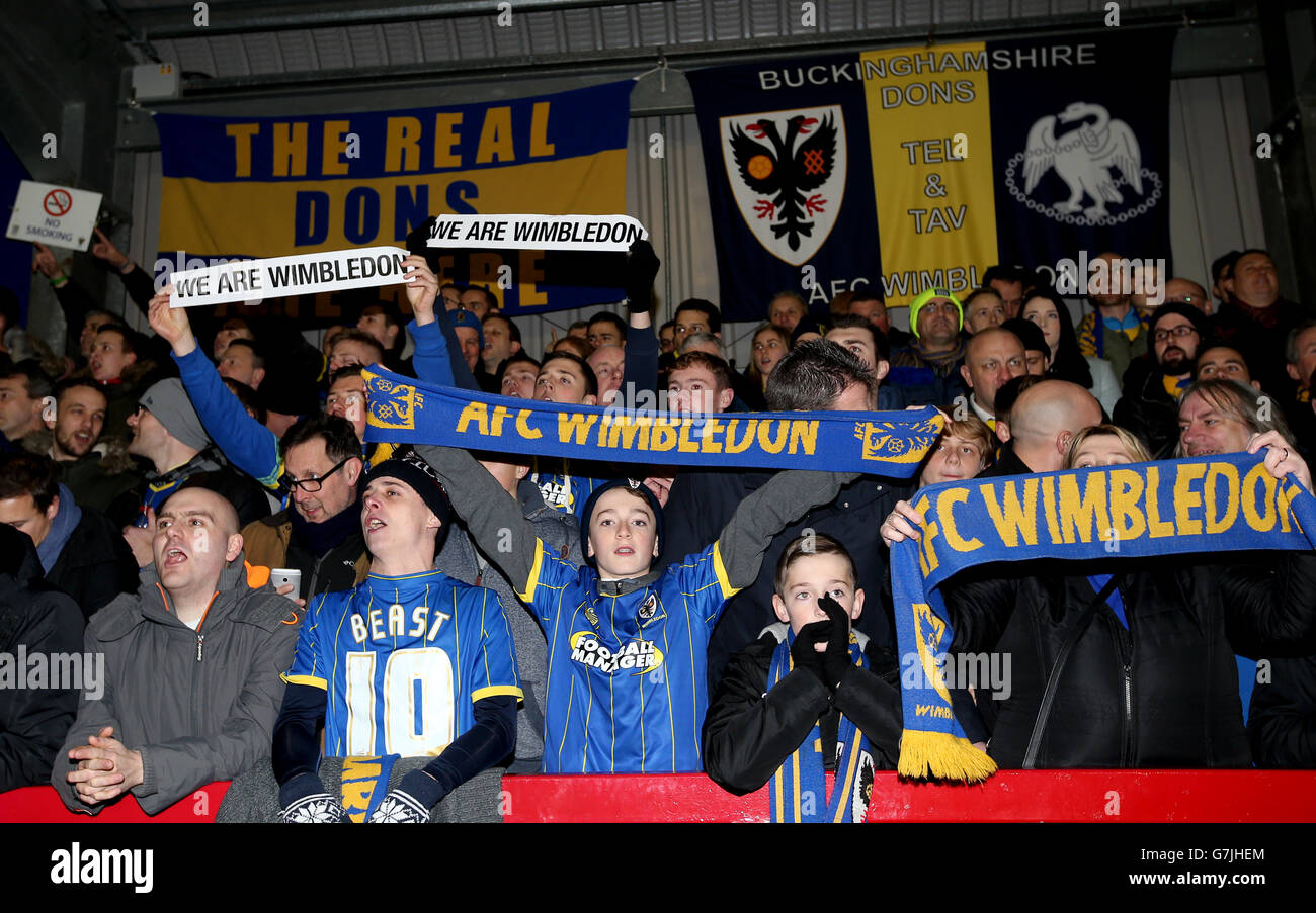 Afc wimbledon fans cheer on their team from the stands hi-res stock ...