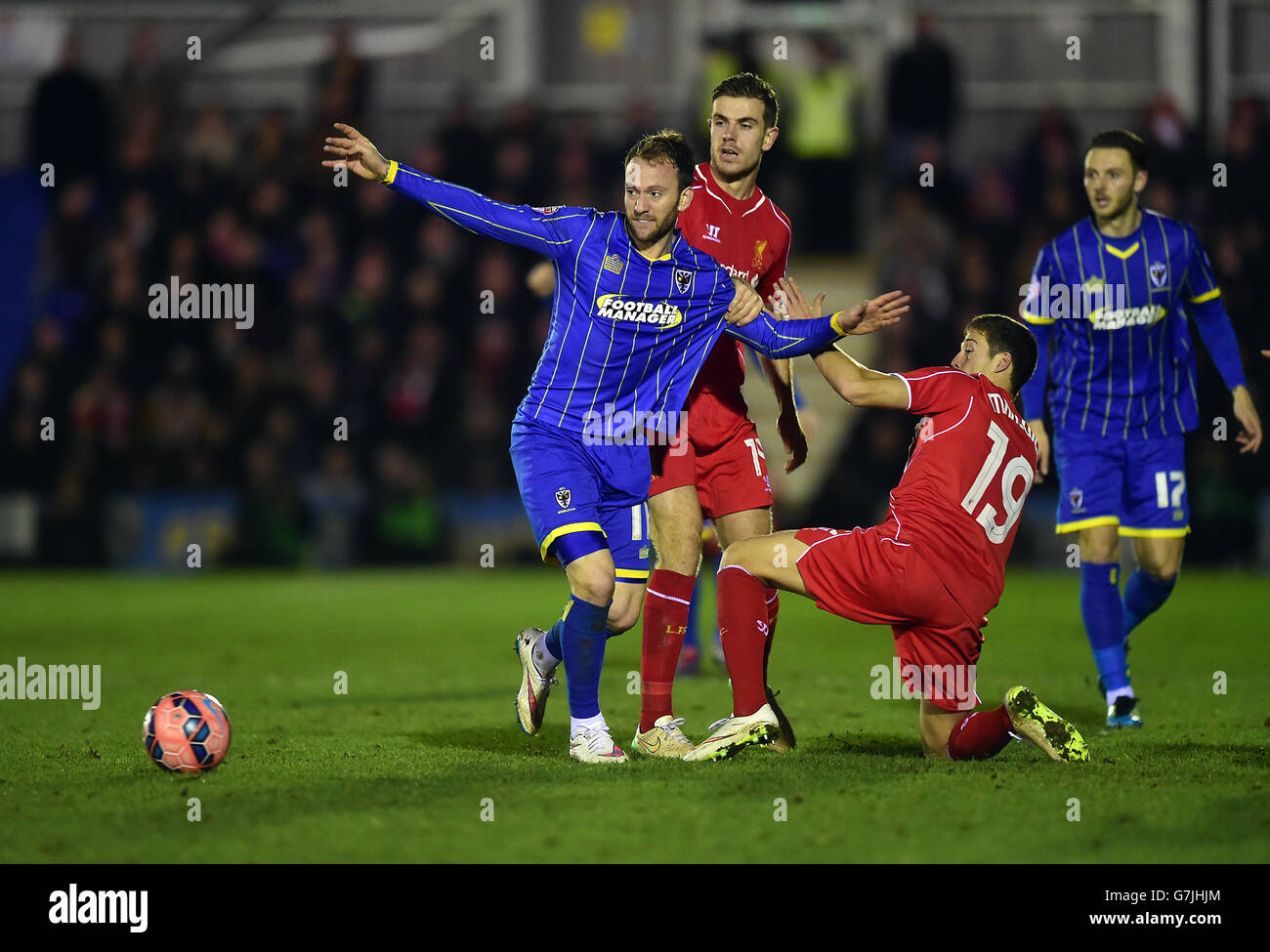 AFC Wimbledon's Sean Rigg, Liverpool's Jordan Henderson and Liverpool's ...