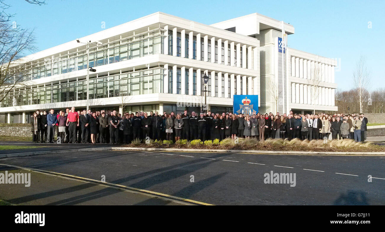 Police officers and staff during a two minute silence outside Durham ...